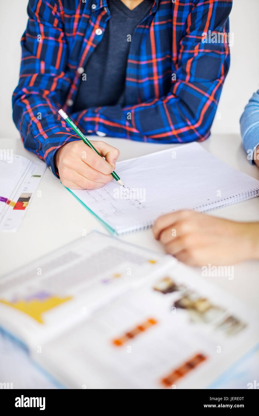 Teenage boys doing homework Stock Photo - Alamy