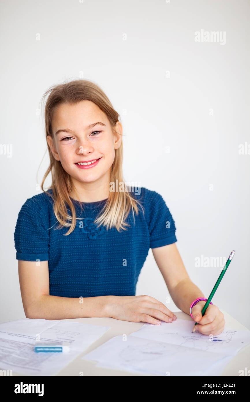 Girl doing homework Stock Photo - Alamy