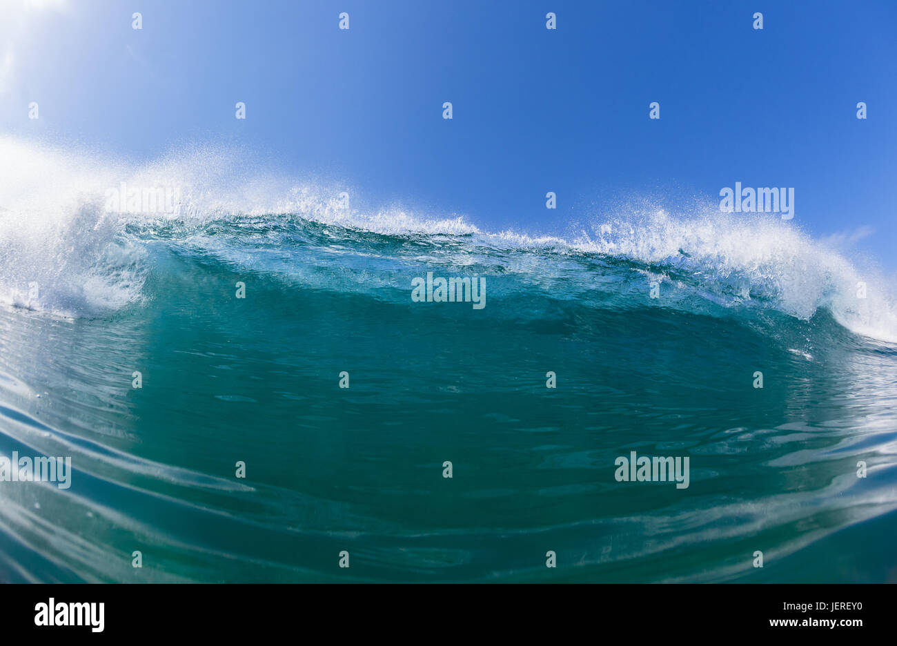 Wave crashing closeup swimming blue water ocean photo Stock Photo - Alamy