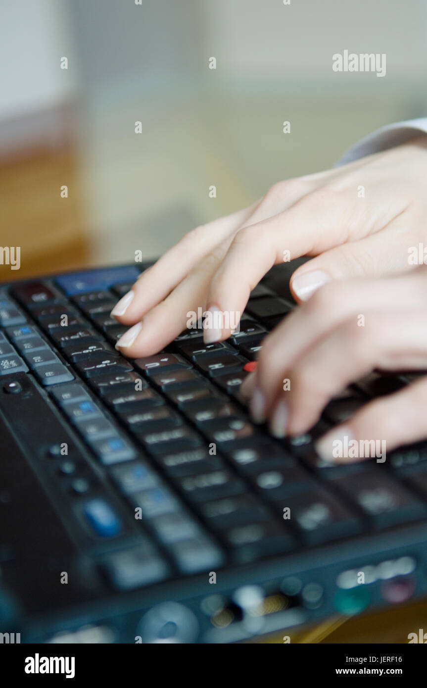 Womans hands on laptop keyboard Stock Photo - Alamy