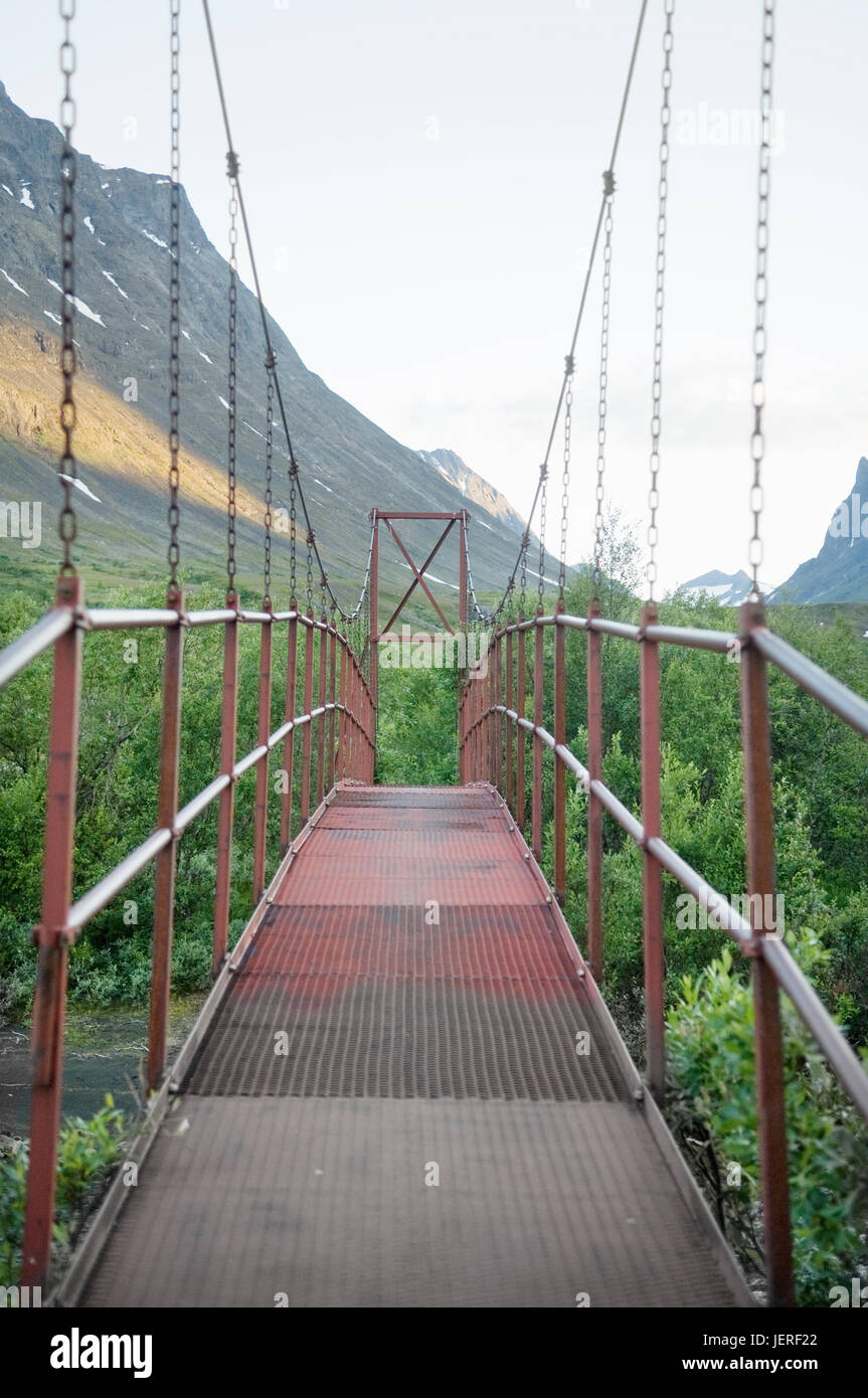 Hanging footbridge in mountains Stock Photo - Alamy