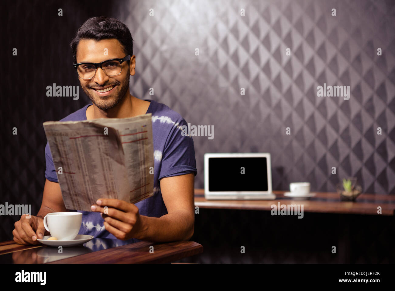 Man reading the newspaper Stock Photo - Alamy