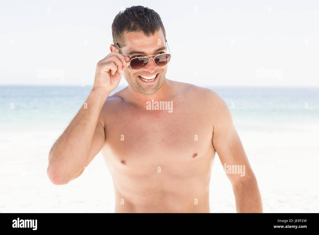 Portrait of smiling man on the beach Stock Photo - Alamy