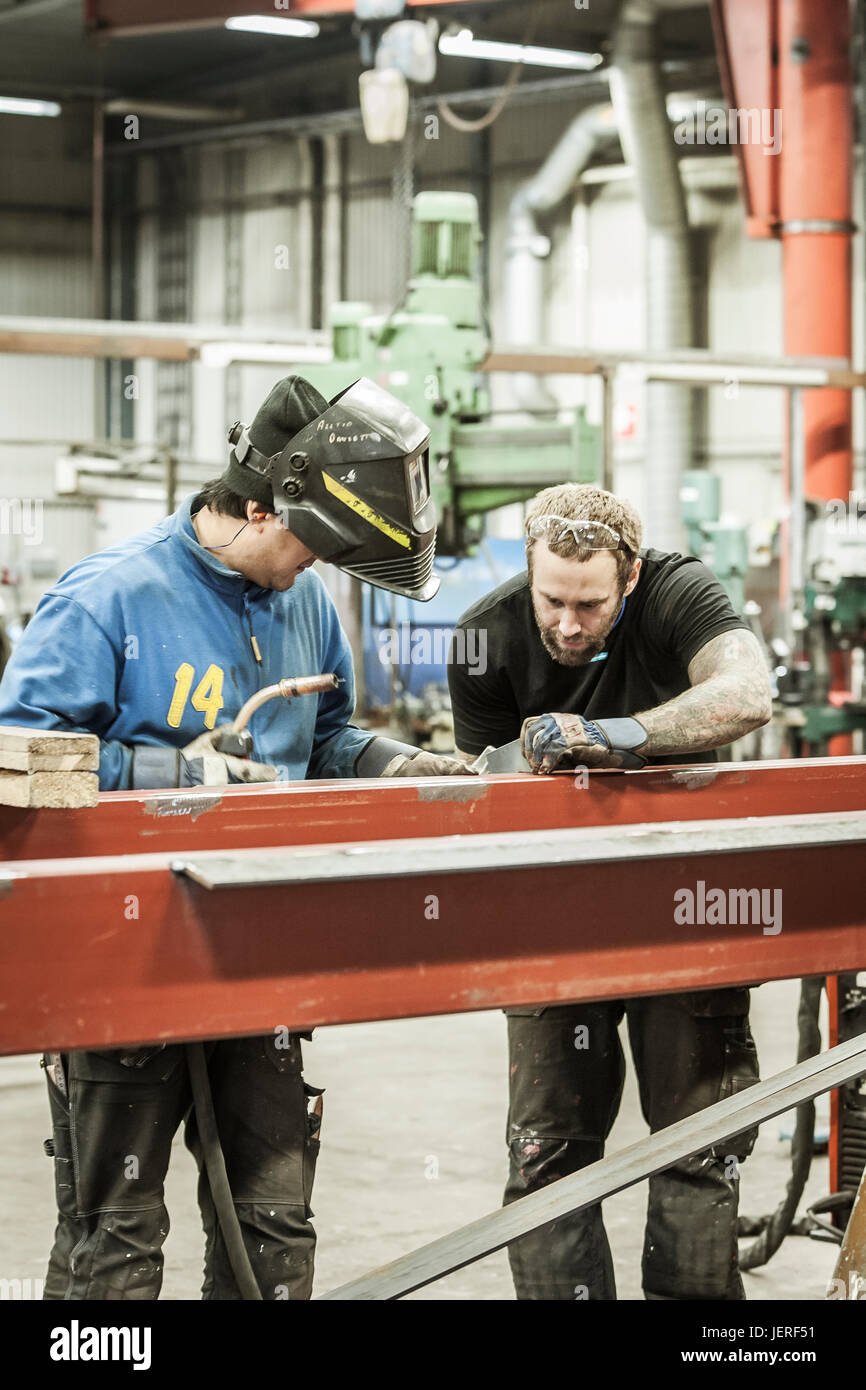 Men working in workshop Stock Photo - Alamy