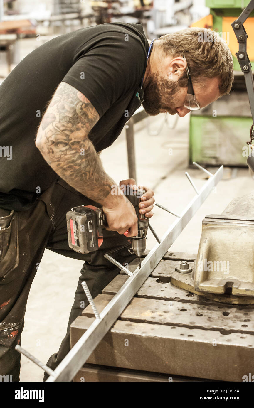 Man working in workshop Stock Photo - Alamy