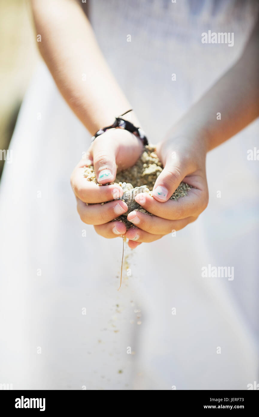 Hands holding sand Stock Photo - Alamy