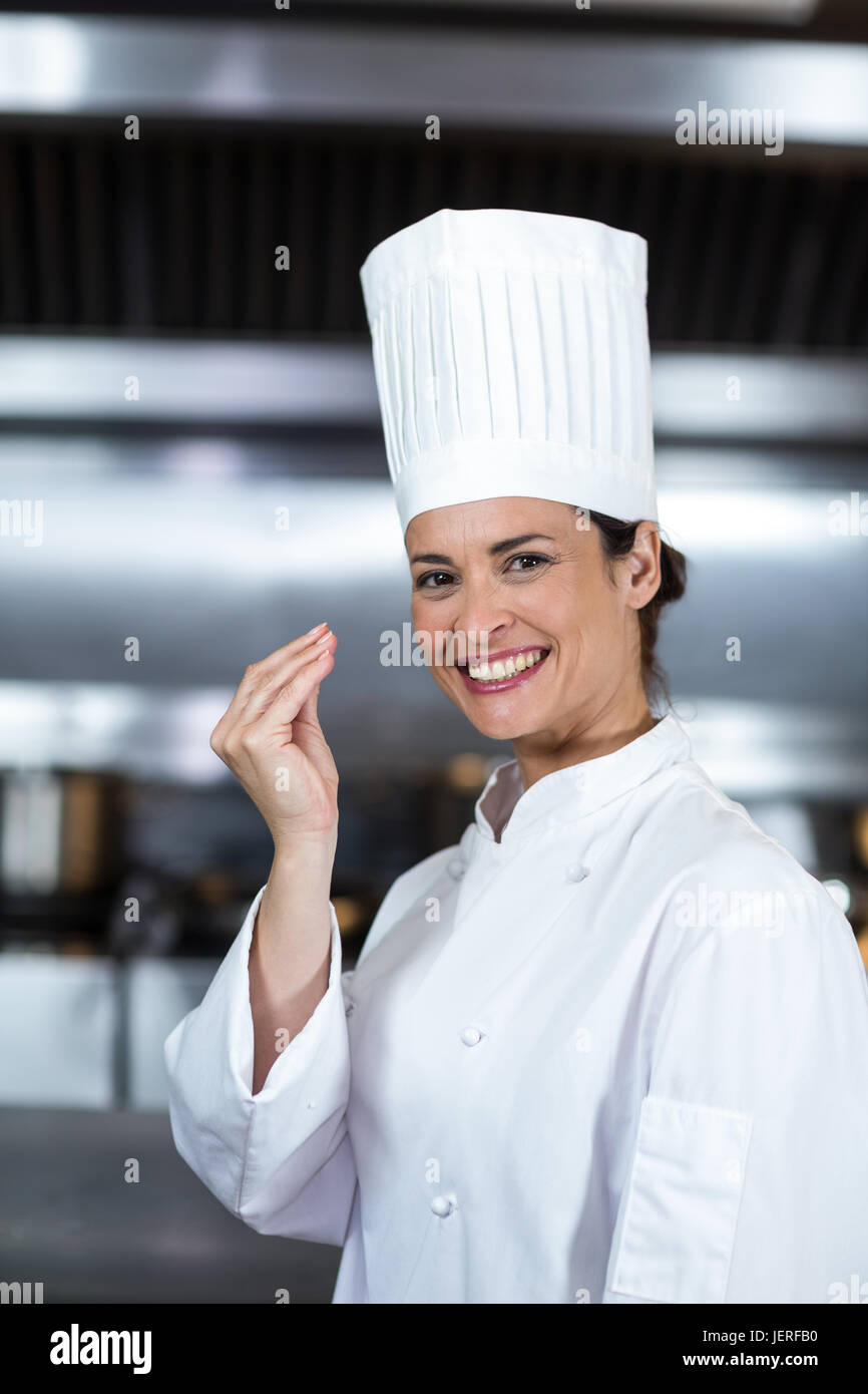 Portrait of smiling female chef gesturing Stock Photo - Alamy