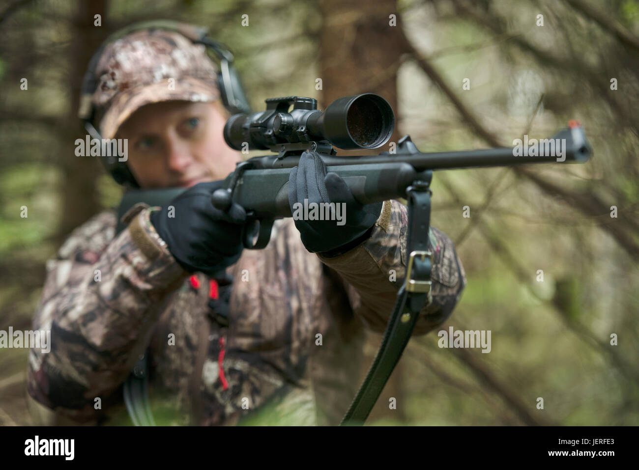 Young woman with hunting rifle hi-res stock photography and images - Alamy