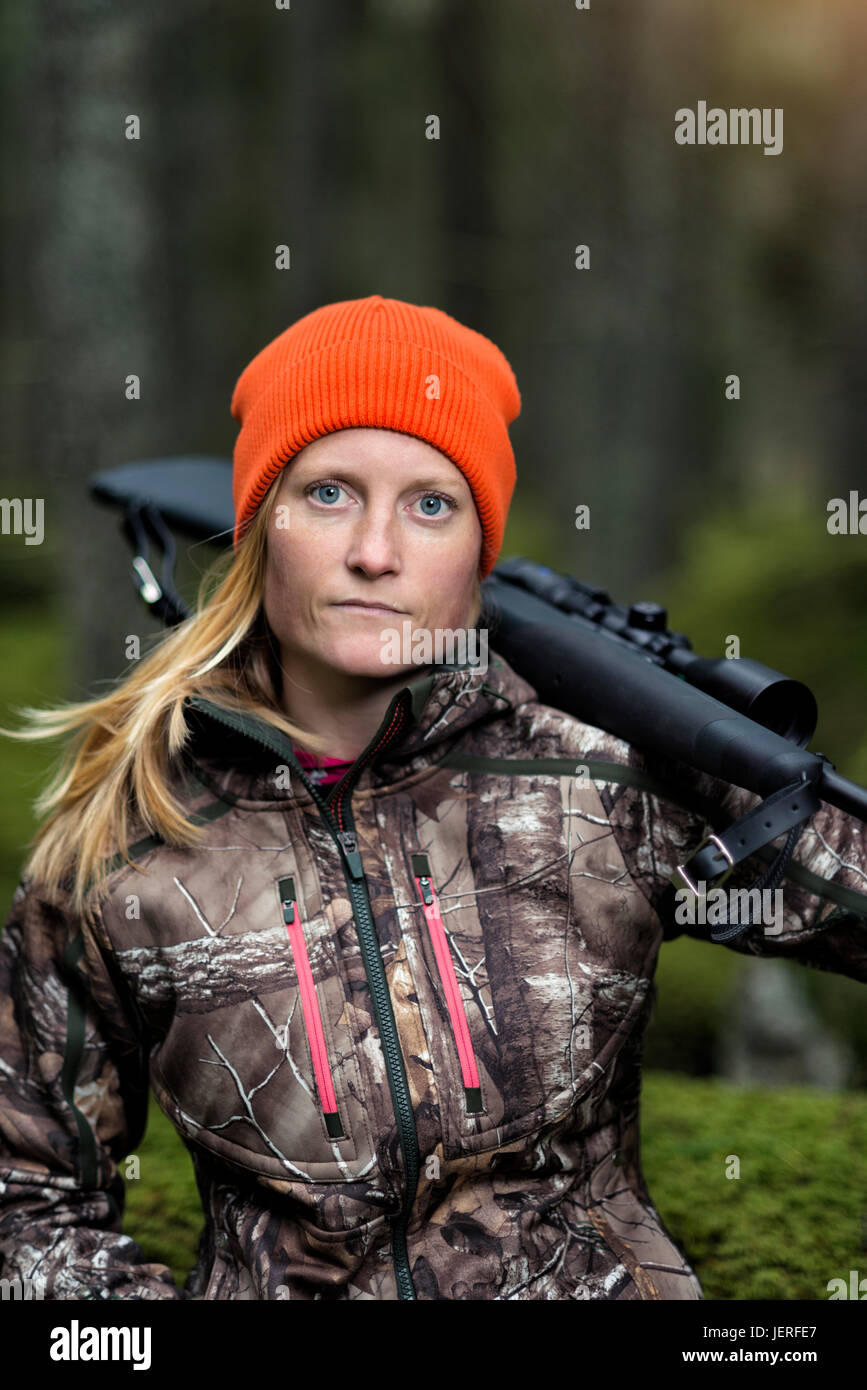 Woman hunting in forest Stock Photo - Alamy