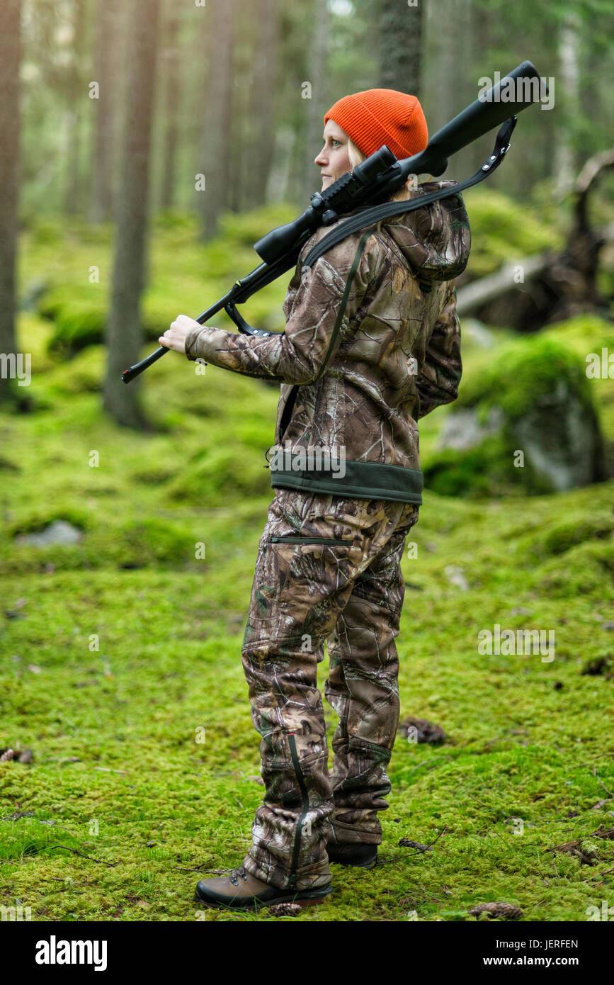Young woman with hunting rifle hi-res stock photography and images - Alamy