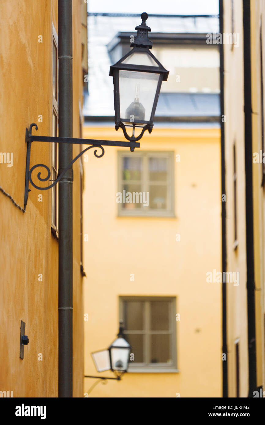 Lantern on building wall Stock Photo - Alamy