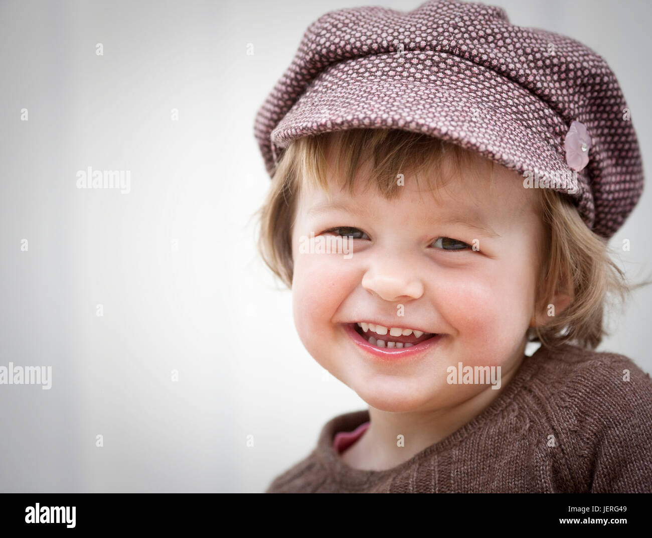 Smiling girl wearing cap Stock Photo - Alamy