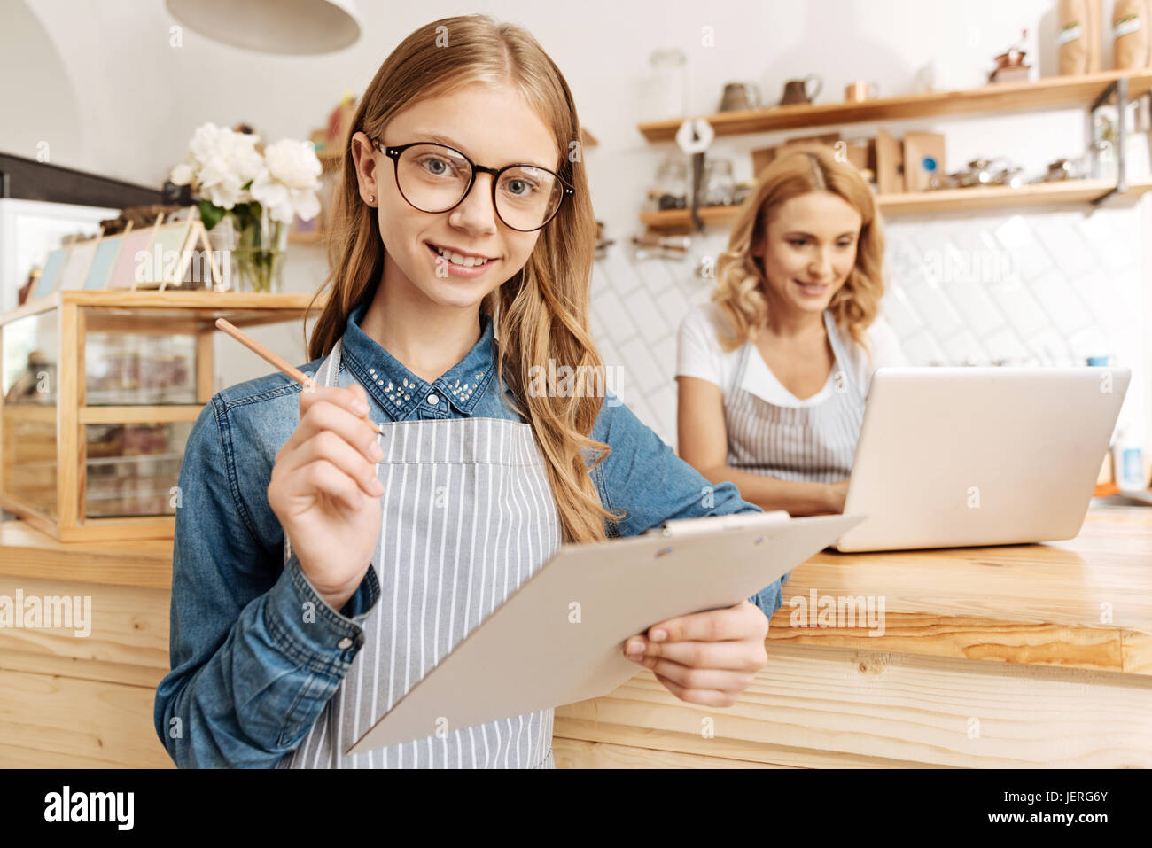 Lovely teenage girl being about to put down another task Stock Photo ...