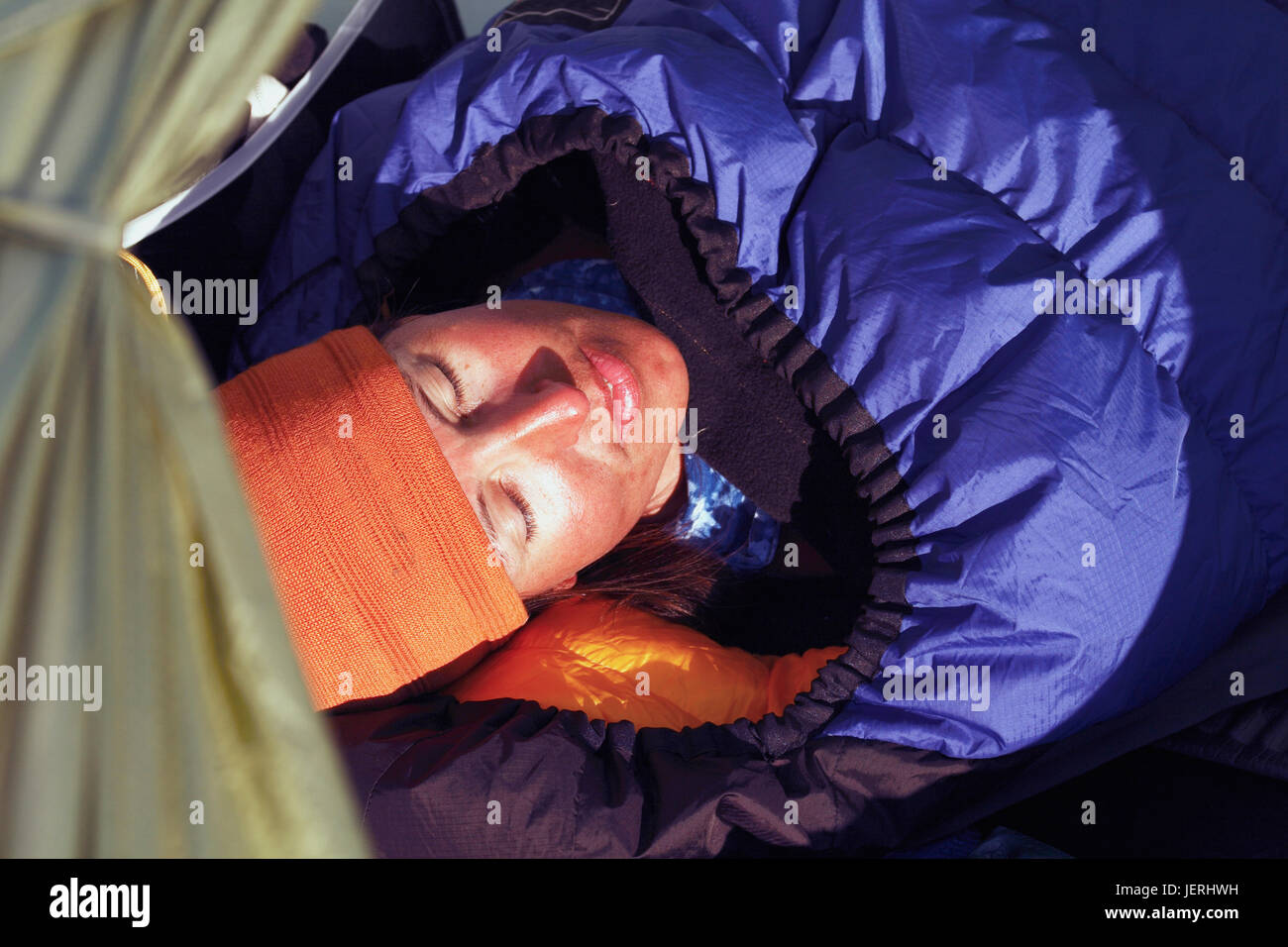 Woman sleeping in sleeping bag Stock Photo - Alamy