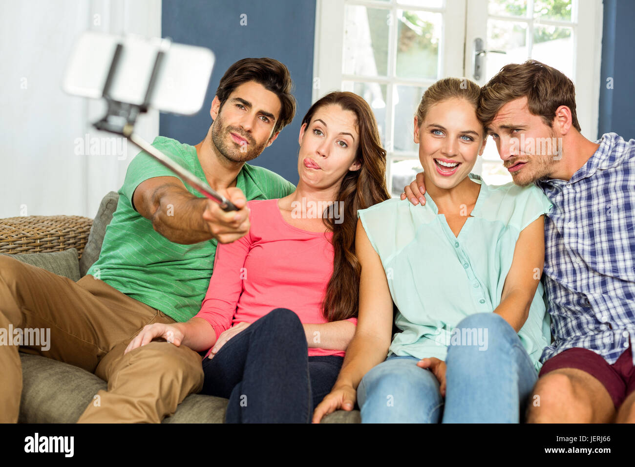 Joyful woman making selfie home hi-res stock photography and images - Alamy