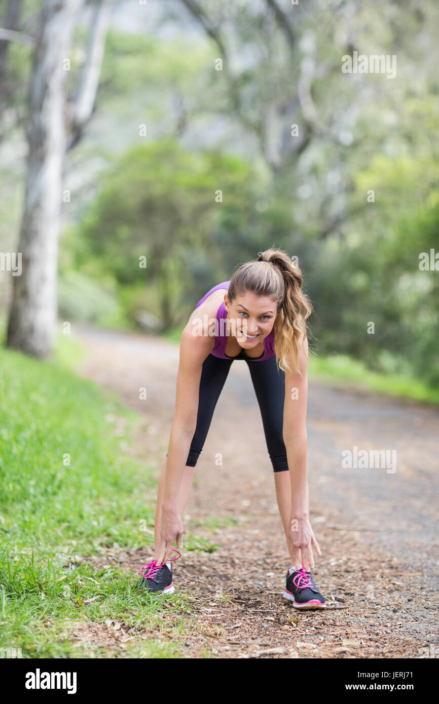 Young woman bending over outdoors hi-res stock photography and images ...