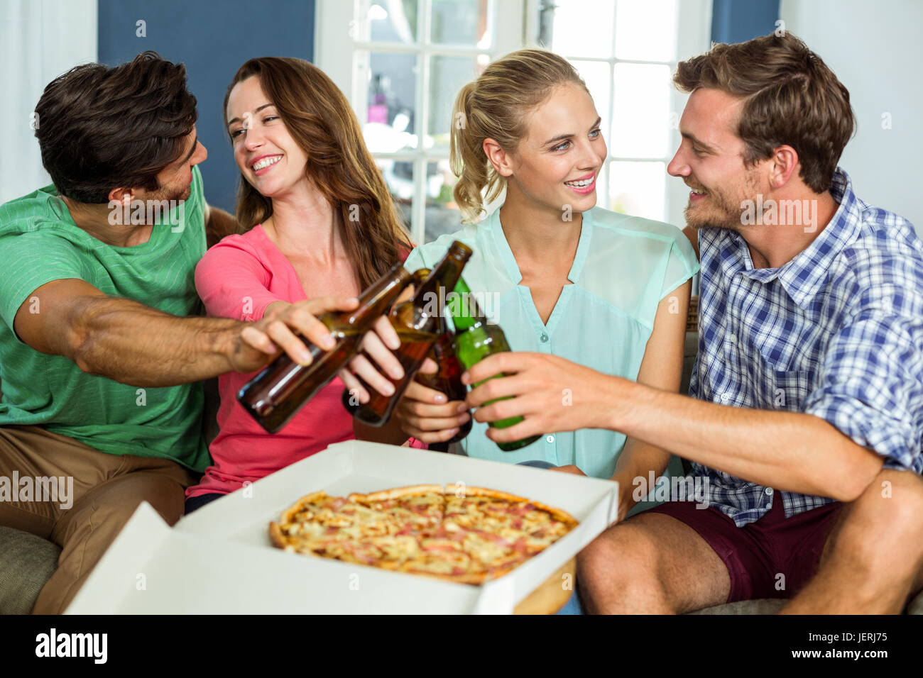 Friends enjoying party at home Stock Photo - Alamy