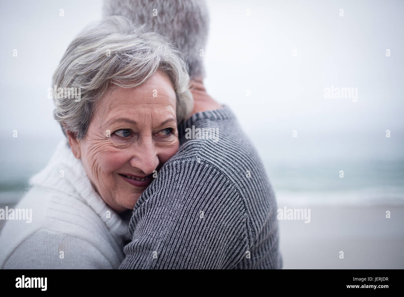 Happy senior couple embracing each other Stock Photo - Alamy