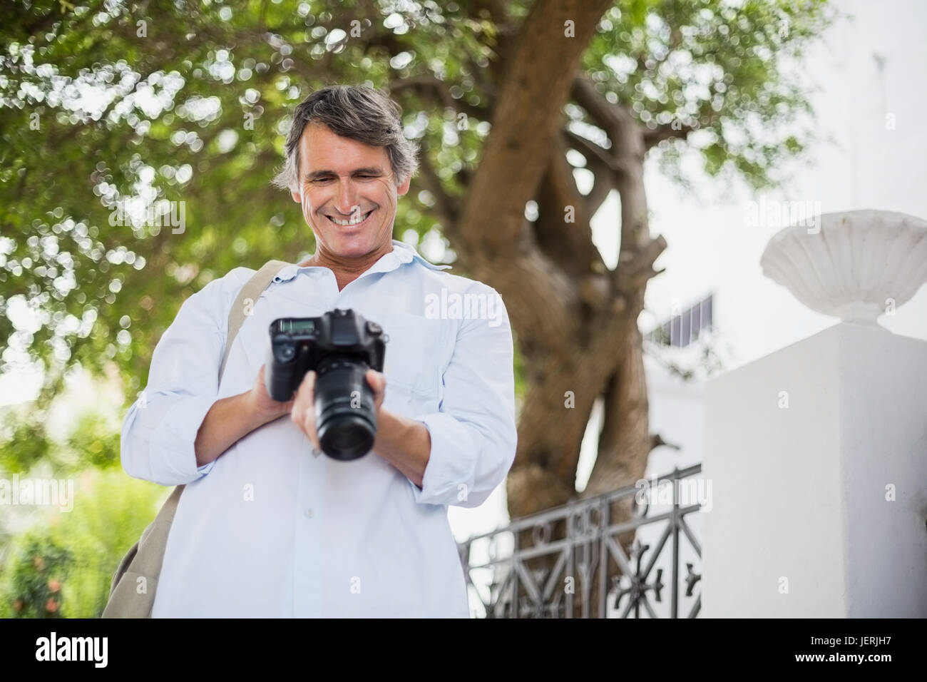 Happy man looking into camera Stock Photo - Alamy