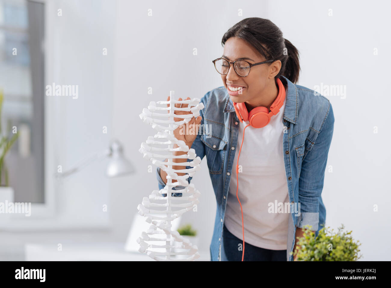 Delighted curious student being interested in genetics Stock Photo - Alamy