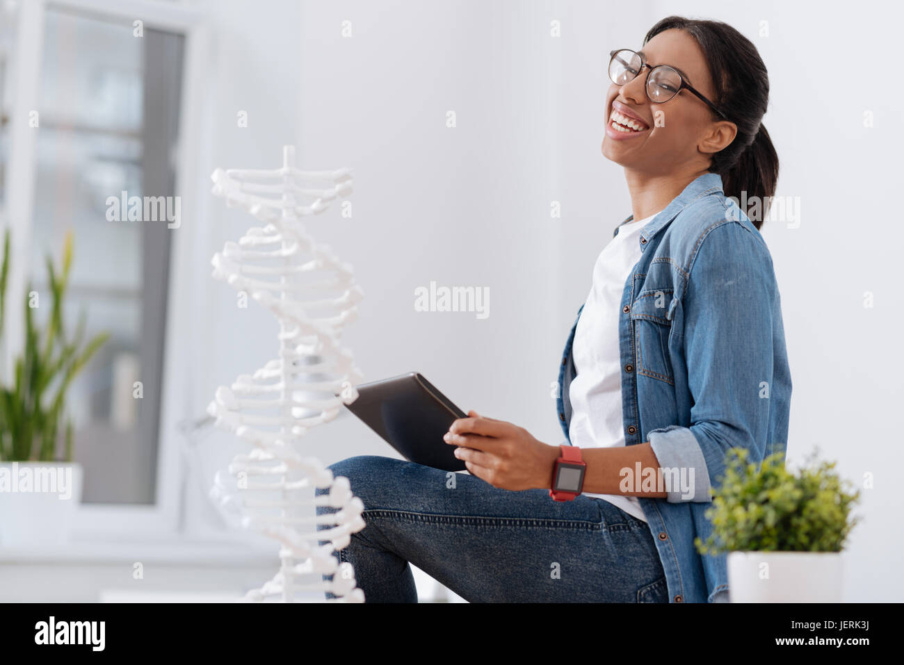 Happy smart woman laughing Stock Photo - Alamy