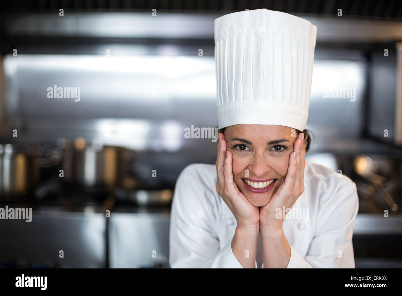 Portrait of beautiful female chef in kitchen Stock Photo - Alamy