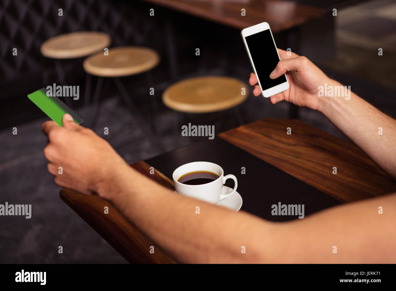 Hipster man giving his credit card Stock Photo - Alamy