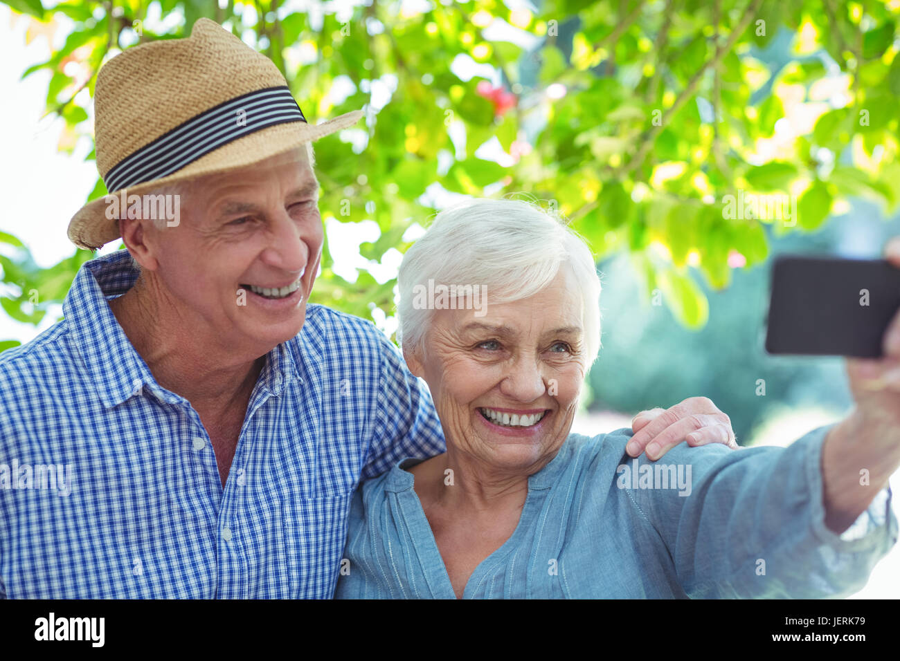 Happy retired couple taking selfie Stock Photo - Alamy