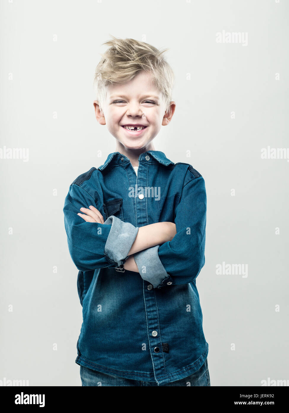 Boy with crossed arms Stock Photo - Alamy