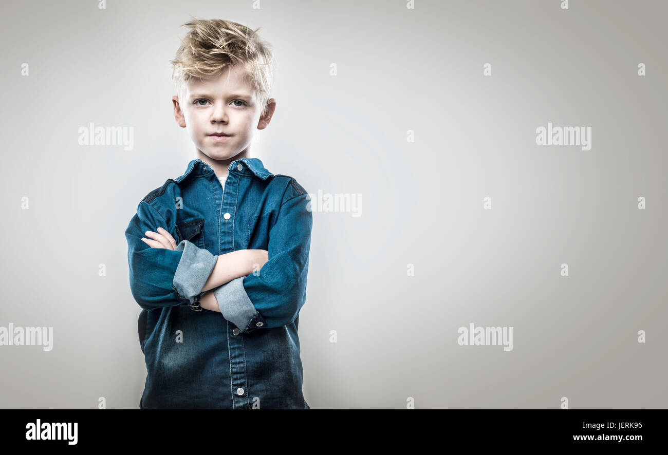 Boy with crossed arms Stock Photo - Alamy