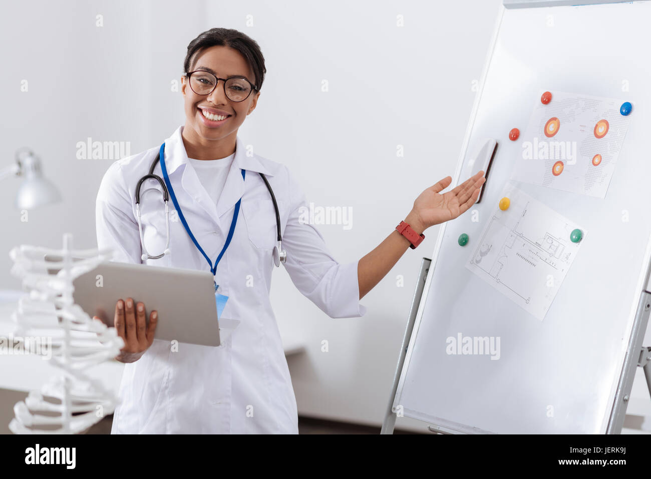 Happy delighted scientist pointing at the whiteboard Stock Photo - Alamy
