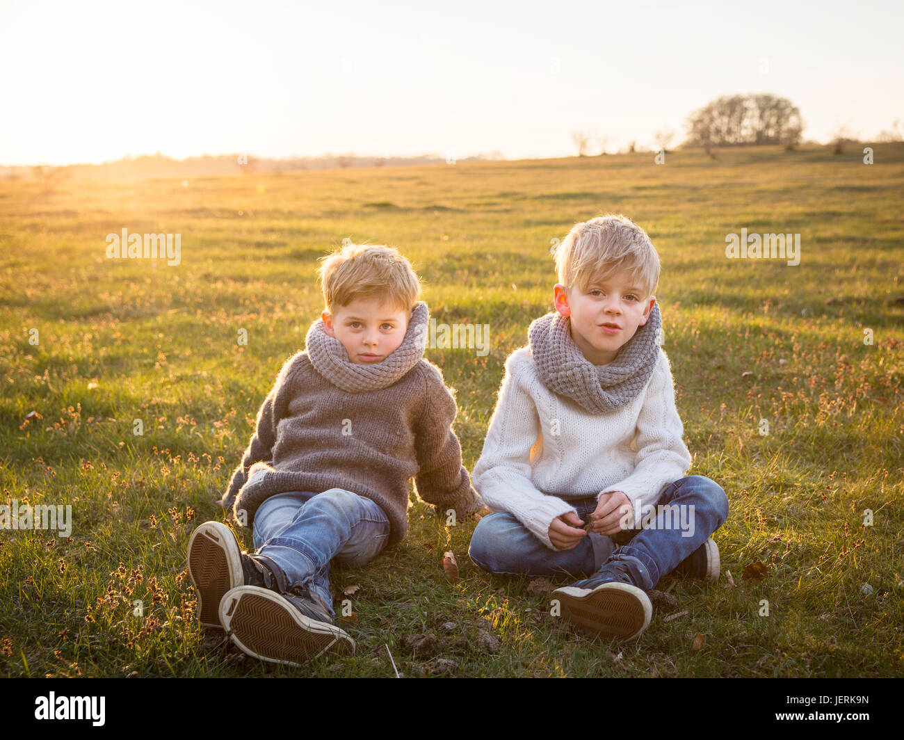 Boys sitting together hi-res stock photography and images - Alamy