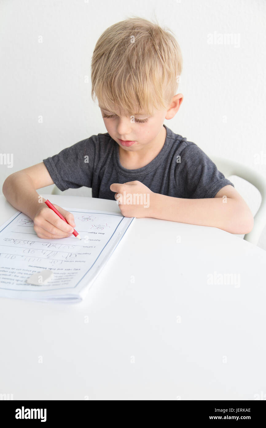Boy doing homework Stock Photo - Alamy