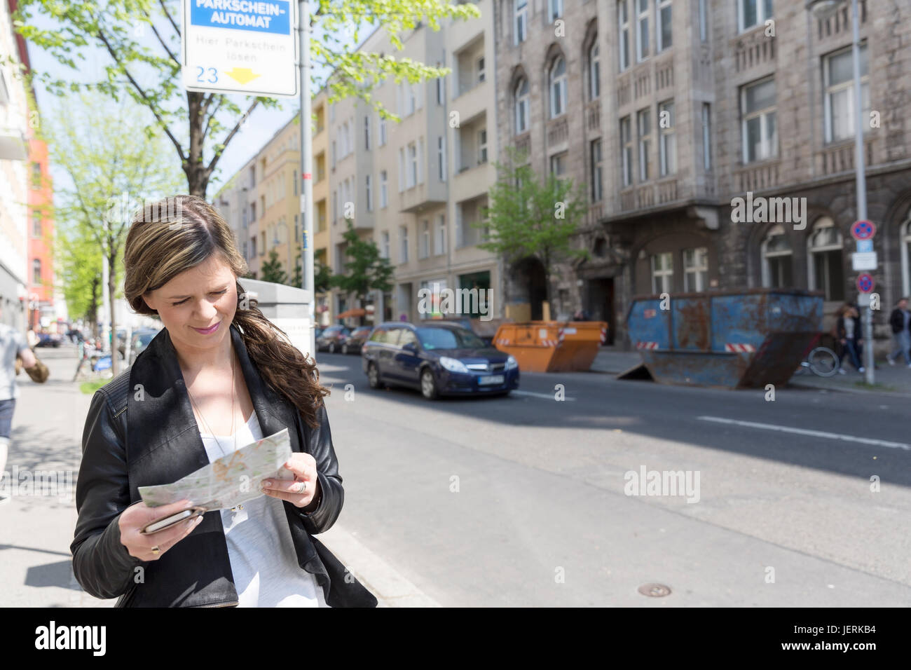 Woman with map Stock Photo - Alamy