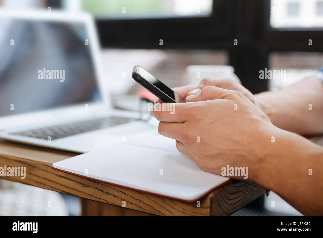 Friendly fun guy typing a message Stock Photo - Alamy