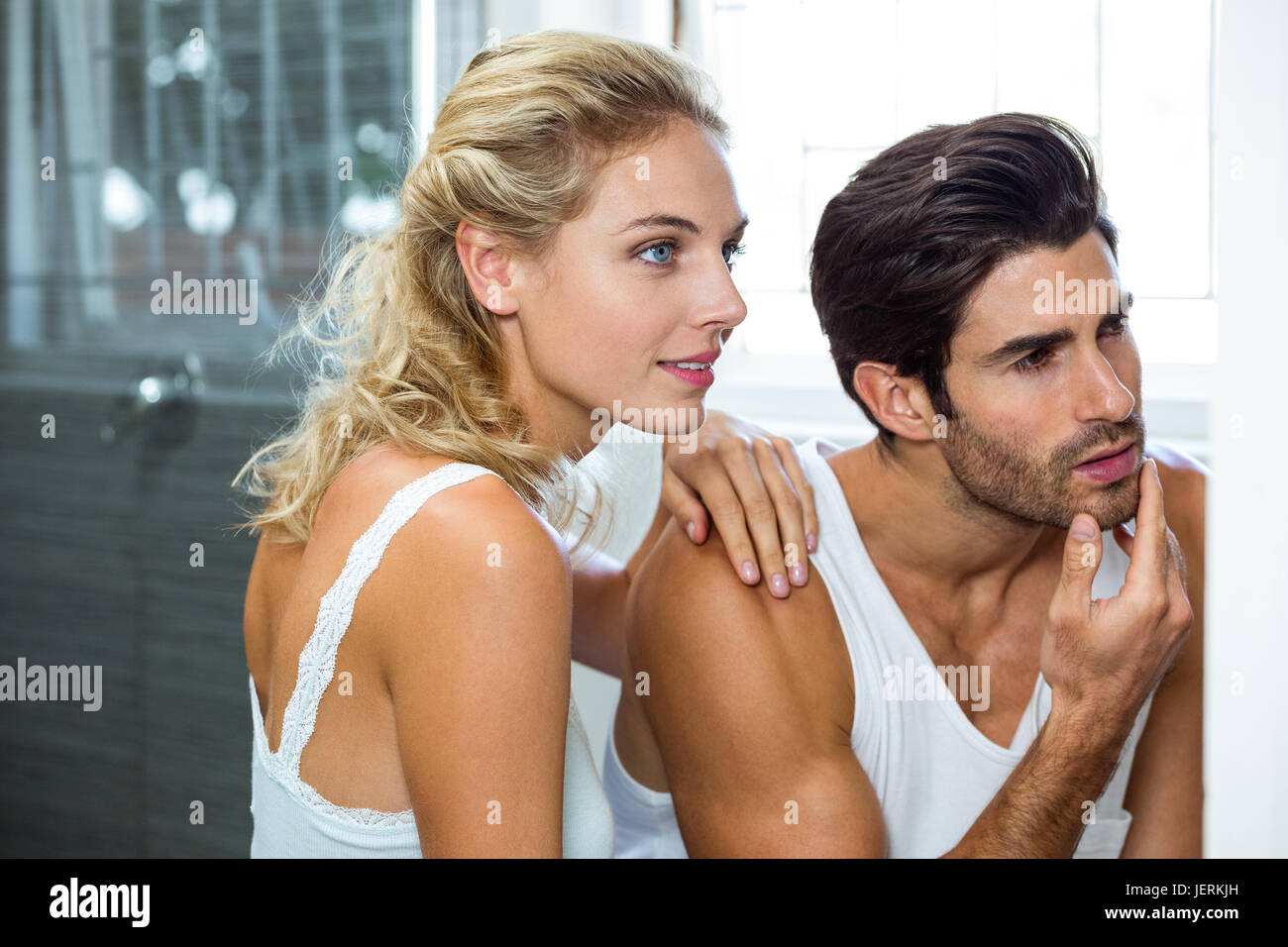 Man checking his stubble in bathroom Stock Photo - Alamy