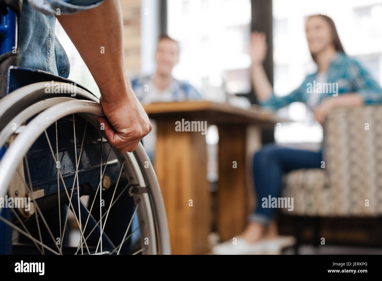Confident handicapped man meeting his friends Stock Photo - Alamy