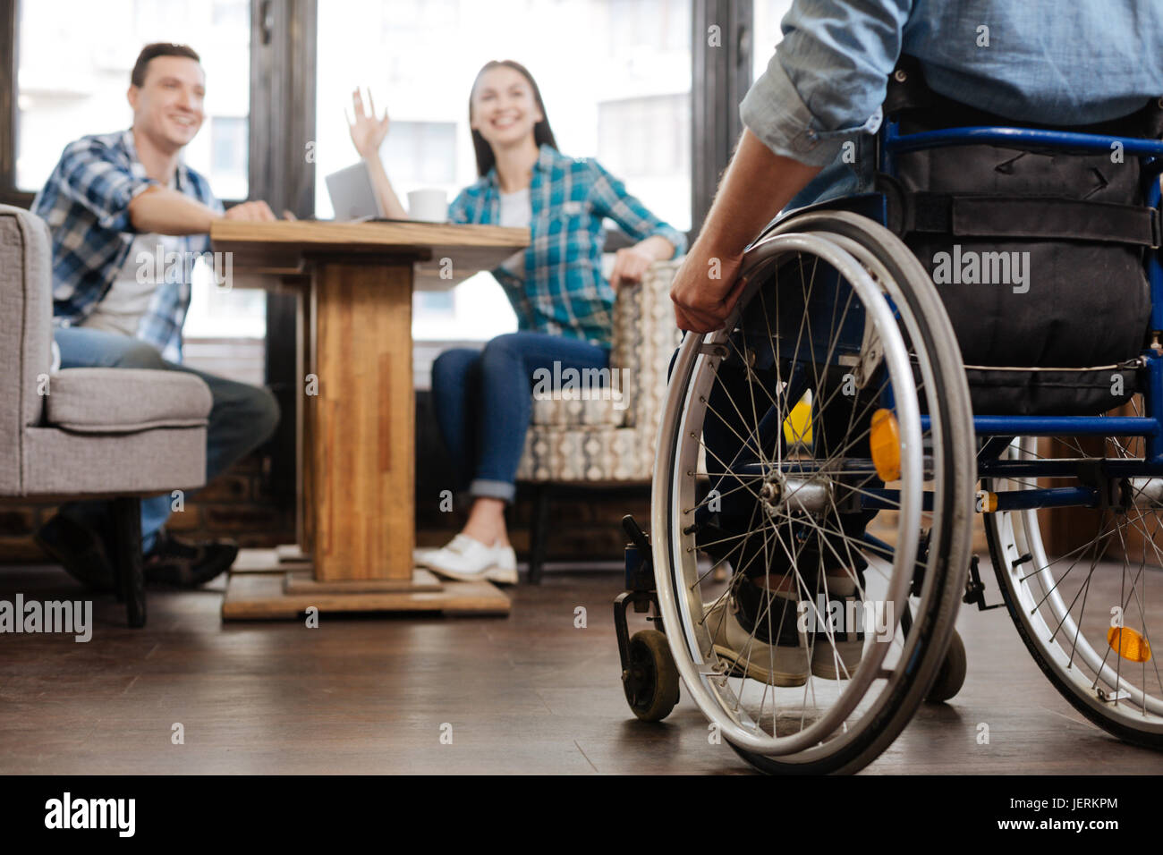 Energetic engaging people happy seeing their friend Stock Photo - Alamy
