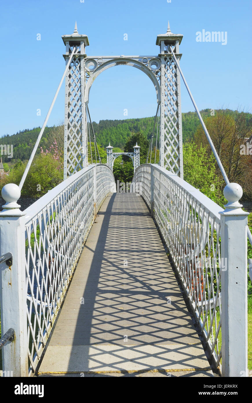 summer shadows on pedestrian bridge over the River Tweed at Peebles ...
