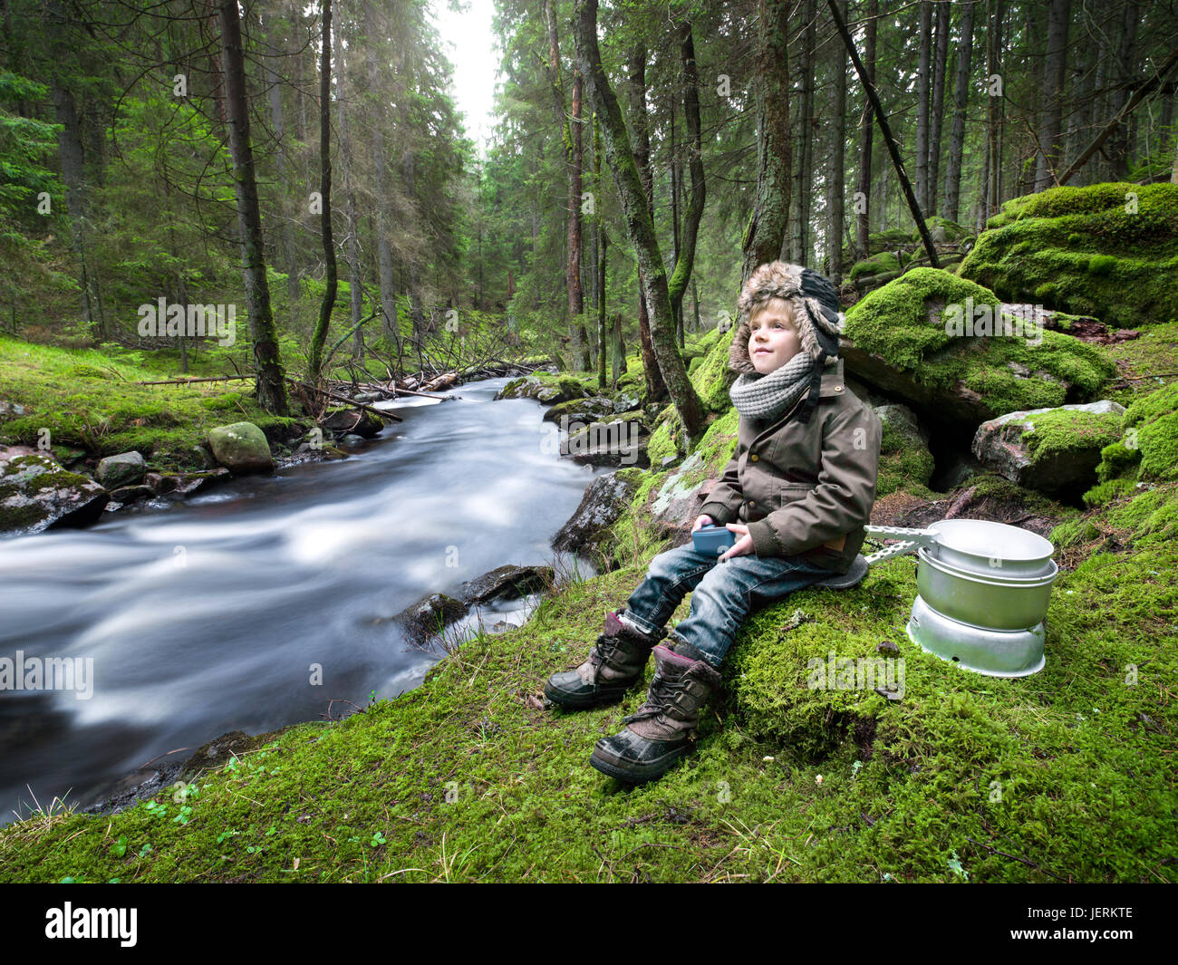 Boy in forest Stock Photo - Alamy