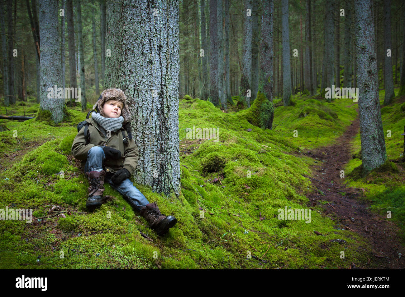 Boy in forest Stock Photo - Alamy