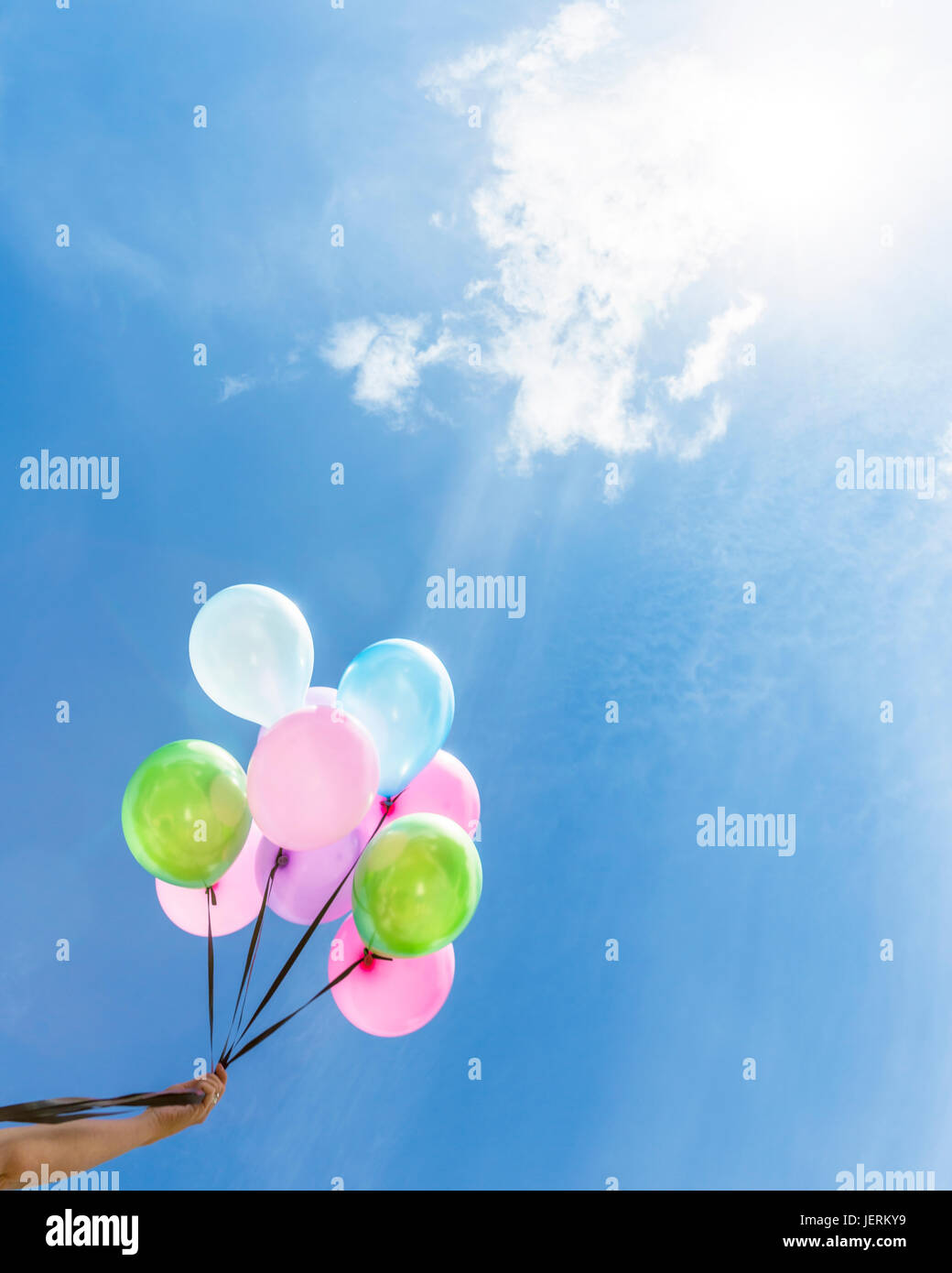 Hand holding balloons hi-res stock photography and images - Alamy