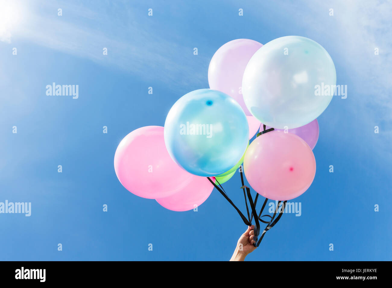 Hand holding balloons hi-res stock photography and images - Alamy