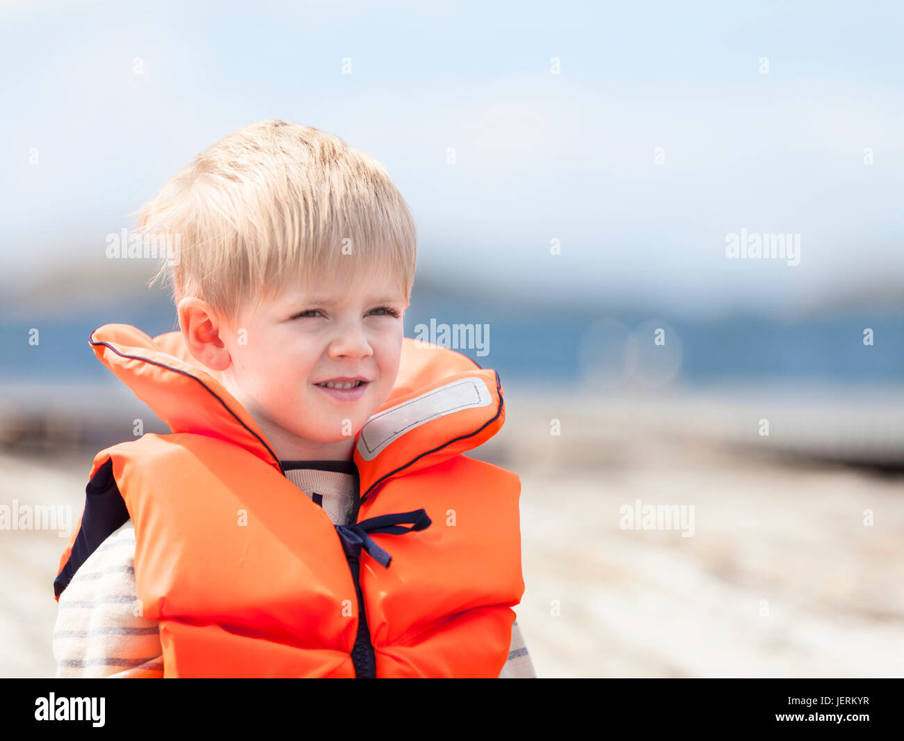 Happy boy wearing jacket hi-res stock photography and images - Alamy