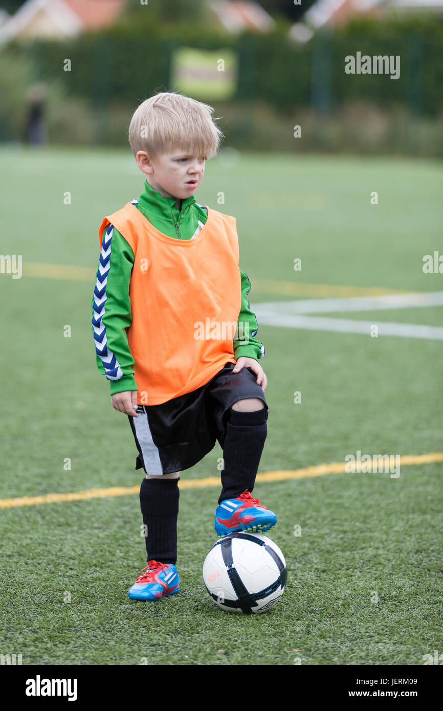 Boy playing soccer Stock Photo - Alamy