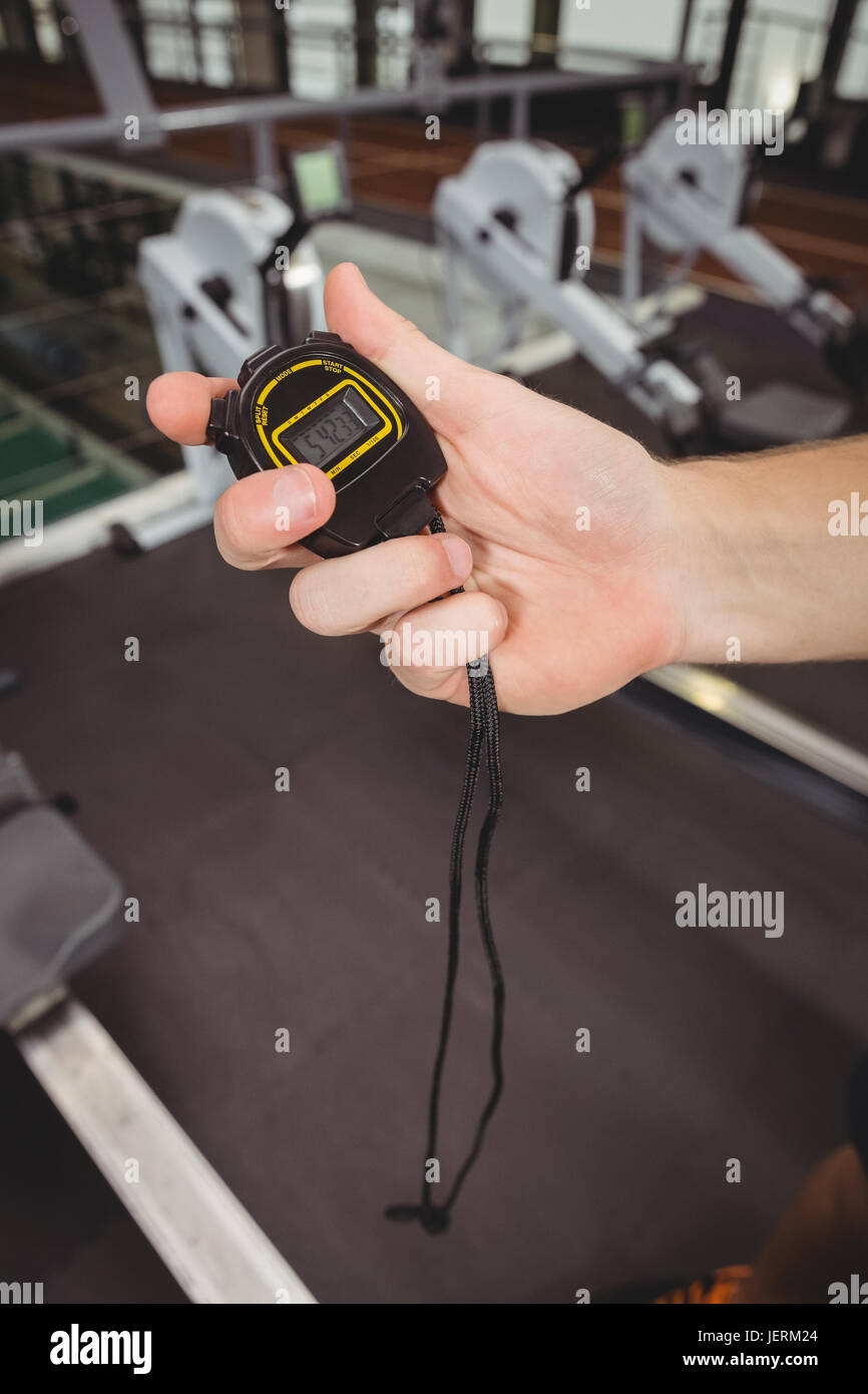Hand holding stopwatch hi-res stock photography and images - Alamy