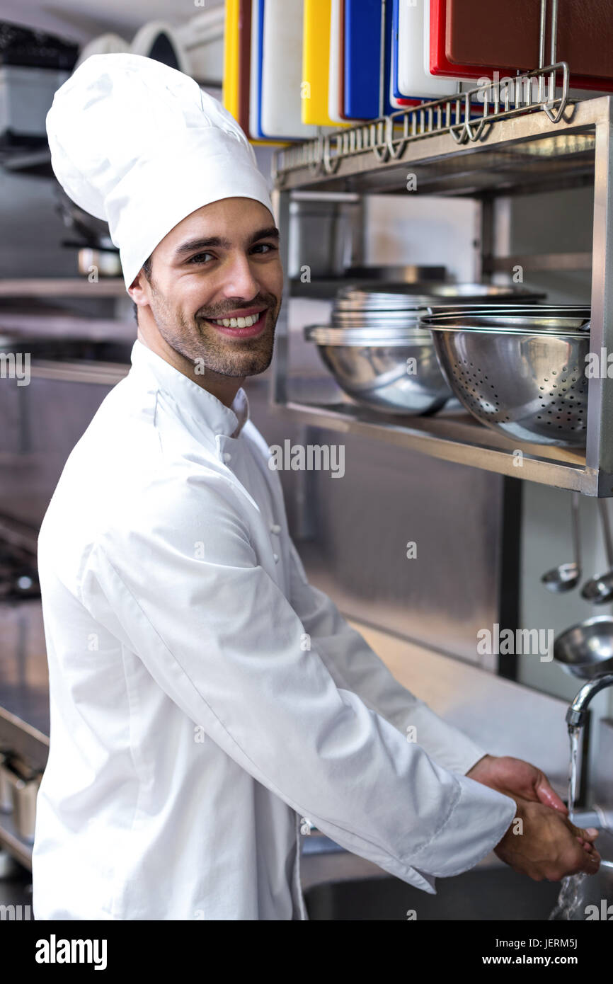 Handsome chef washing his hands Stock Photo - Alamy
