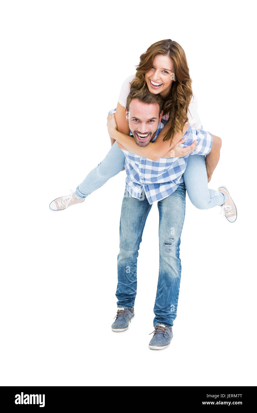 Man giving piggyback ride to woman Stock Photo - Alamy