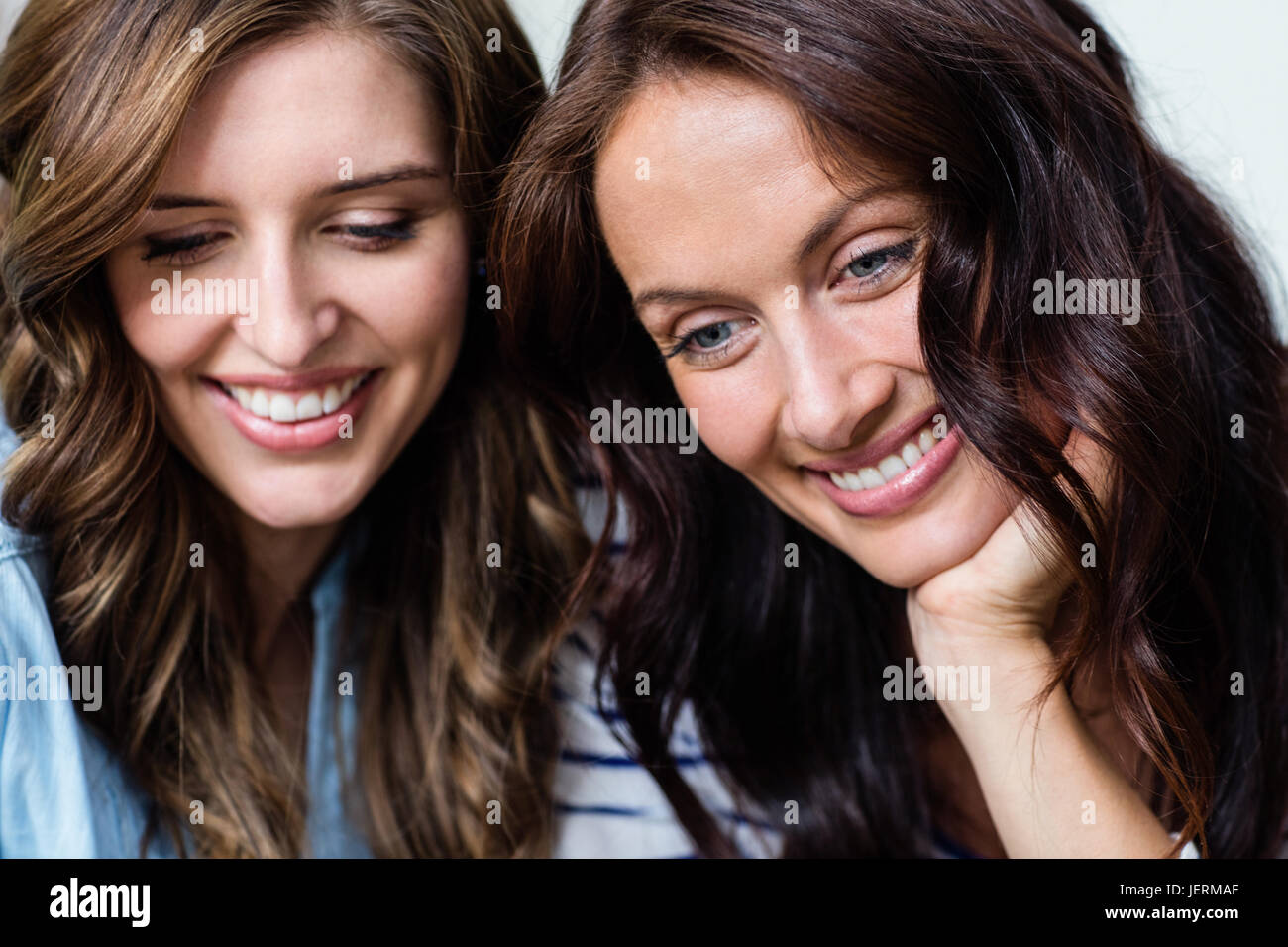 Smiling female friends Stock Photo - Alamy