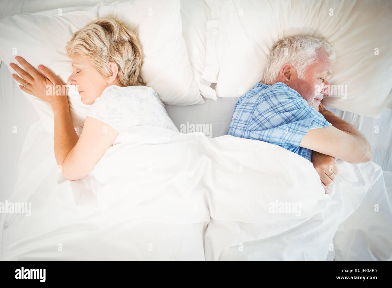 Overhead view of sleeping tired couple Stock Photo - Alamy